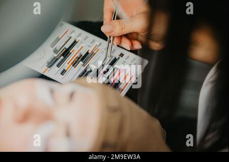A closeup shot of the nail master working on the client's nails Stock ...