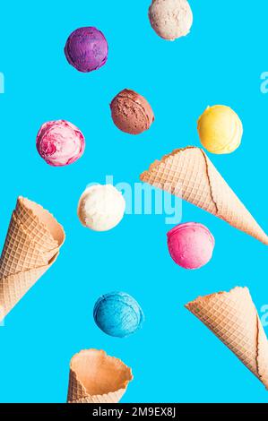 Falling ice cream scoops into the vafel cone on pink background. Food ...
