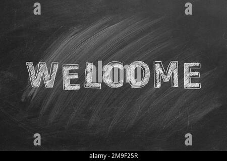 Chalk drawn WELCOME text on blackboard Stock Photo - Alamy
