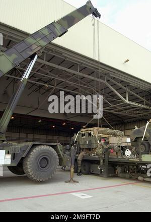 Members of the 173rd Airborne Brigade, Vicenza, Italy, load a High ...