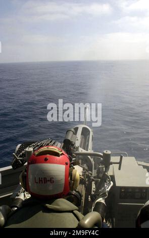 GUNNER's Mate 2nd Class Randy Thomas fires away from the 25mm cannon on ...
