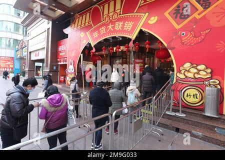 Shanghai. 18th Jan, 2023. People shop for the Spring Festival at a food ...