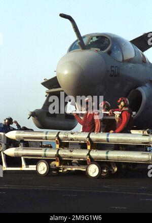 US Navy Aviation Ordnancemen prepare to load 500-pound laser guided ...