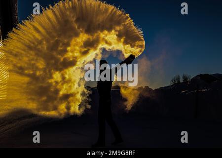 ALTAY, CHINA - JANUARY 18, 2023 - Police officers enjoy pouring water ...