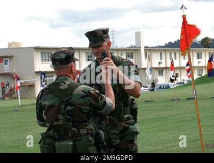 Lieutenant Colonel (LTCOL) McGee and LTCOL Cross await the delivery of ...