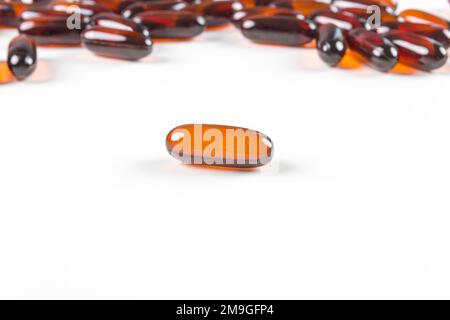 Leptin capsules on white background. Leptin is an appetite reducing ...