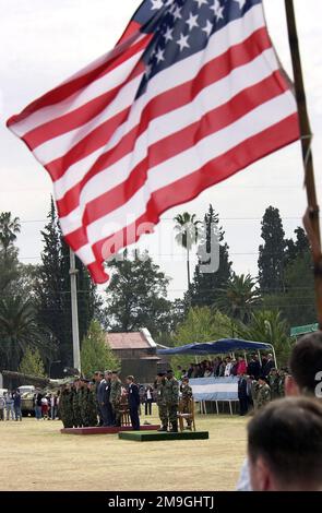 Military and civilian leaders stand during the playing of the national ...