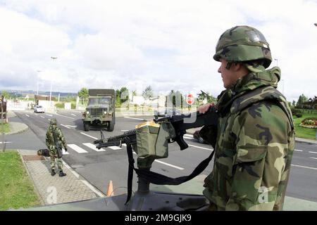 Manning an M998 High-Mobility Multipurpose Wheeled Vehicle (HMMWV) with ...