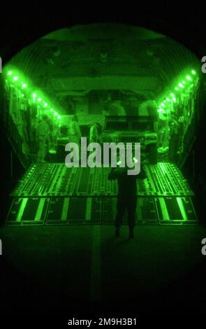 Members of the 615th Tanker Airlift Control Element use a 10K-AT ...