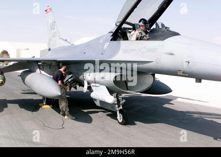 AIRMAN First Class (A1C) Charles P. Kapinos, gives the full-stop sign ...