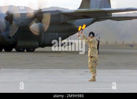 With an M-16 slung over his shoulder an Air Force Technical Sergeant ...