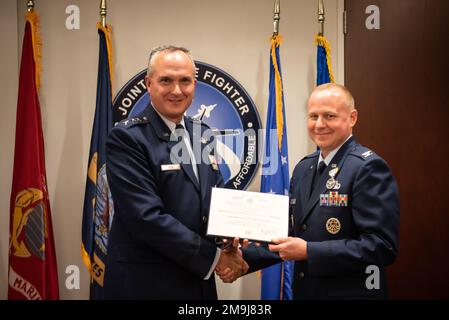 Air Force Col. Ryan Mueller (center), salutes Air Force Lt. Gen. Eric ...