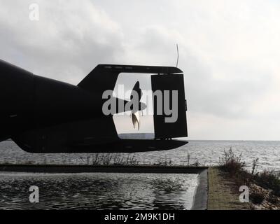 Rusty propeller of old submarine with rudder in back light Stock Photo ...
