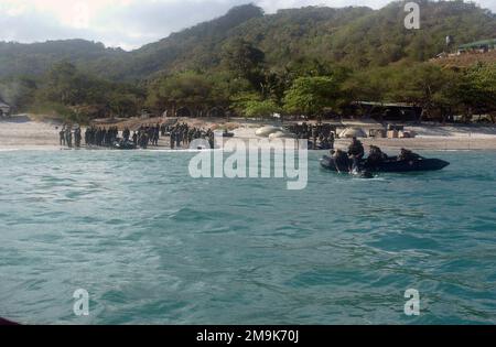 A U.S. Marine of the 32nd Marine Amphibious Unit awaits orders to ...