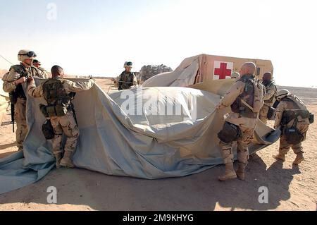 US Navy (USN) Corpsmen and US Marines Corps (USMC) Marines assigned to ...