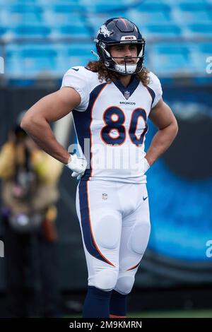 Denver Broncos tight end Greg Dulcich (80) catches a pass next to ...