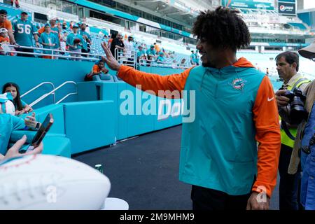Miami Dolphins safety Elijah Campbell waves to fans before an NFL ...