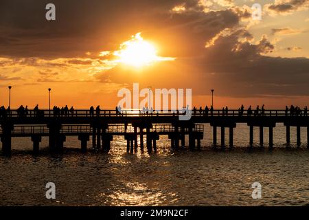 The magnificent historic Palanga Bridge on the Baltic Sea at sunset in ...