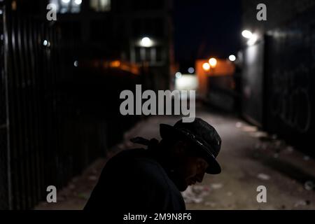 A homeless addict falls asleep in an alley after smoking fentanyl in ...