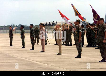 U.S. and Singapore Air Force personnel attend a briefing in front of an ...
