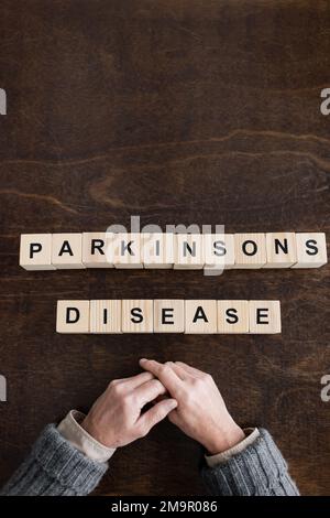 top view of cropped man with parkinson disease and hands tremor ...