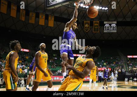 McNeese State forward Christian Shumate, right, drives the ball inside ...