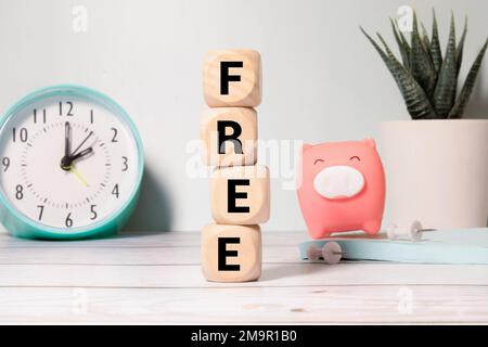 the word free on wooden blocks on black background. Business concept ...