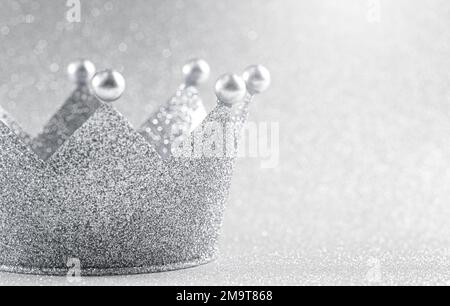 Classic Silver Crown on a Glittery Silver Background Stock Photo - Alamy