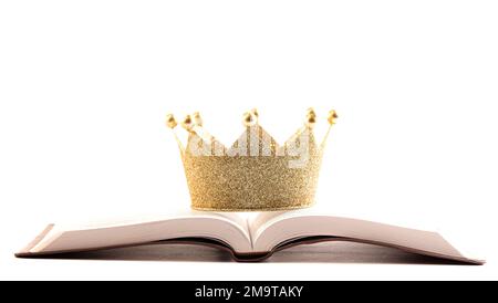 A Golden Crown on a Holy Bible Isolated on a White Background Stock ...