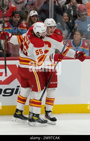 Calgary Flames center Adam Ruzicka (63) passes the puck under the stick ...