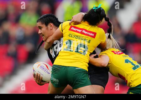 New Zealand's Annetta-Claudia Nu'uausala, center, is tackled during the ...
