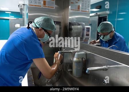 Open heart surgery doctor perform open heart surgery. Doctors in green ...