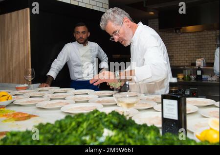 Chef Eyal Shani prepares a meal at HaSalon Miami's One-Year Anniversary ...