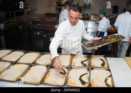 Chef Eyal Shani prepares a meal at HaSalon Miami's One-Year Anniversary ...