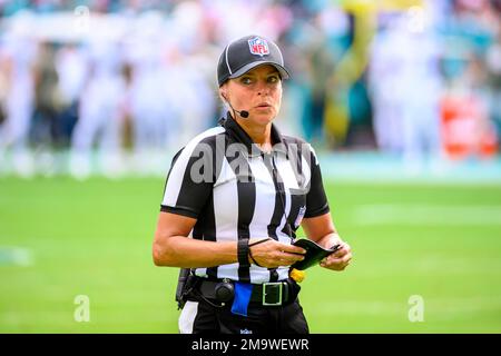NFL back judge Robin DeLorenzo walks on the field during an NFL ...