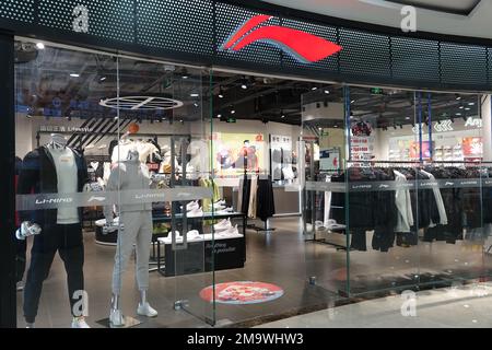 YICHANG, CHINA - JANUARY 18, 2023 - Pedestrians pass a sign of Huawei ...