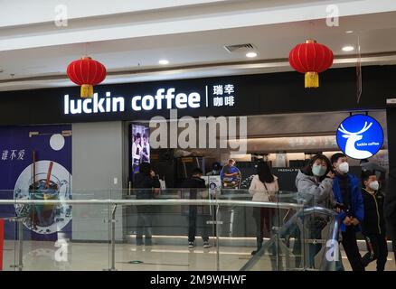 YICHANG, CHINA - JANUARY 18, 2023 - Pedestrians pass a sign of Huawei ...