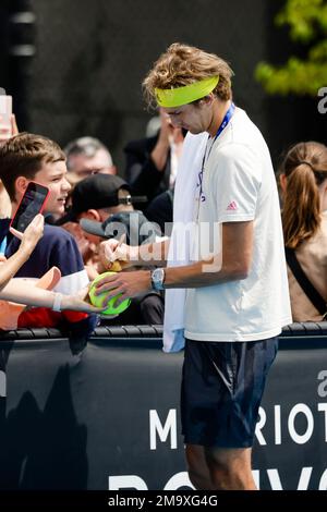 Alexander Zverev of Germany signs autographs after defeating Lucas Pouille of France in their ...