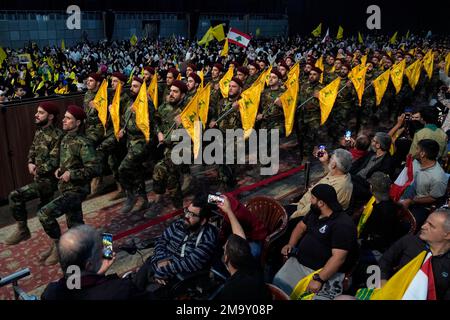 Hezbollah fighters parade during a rally marking Hezbollah Martyr's Day ...