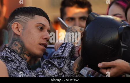 Rapper Santa Fe Klan signs autographs on the red carpet at the premiere ...