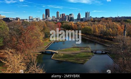 The skyline of downtown Pittsburgh rises behind the pond in Allegheny ...