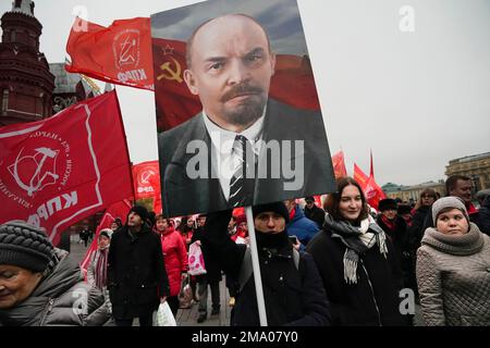 Communist party supporters carry portraits of Soviet founder Vladimir ...