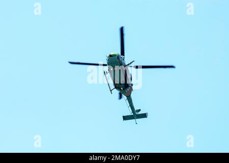 A close-up of a military helicopter flying in cloudless clear sky Stock ...