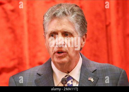 Rhode Island Democratic Gov. Dan McKee, behind, embraces his wife Susan ...