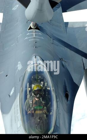 A pilot from the 18th Fighter Squadron (FS) enters the cockpit of his ...