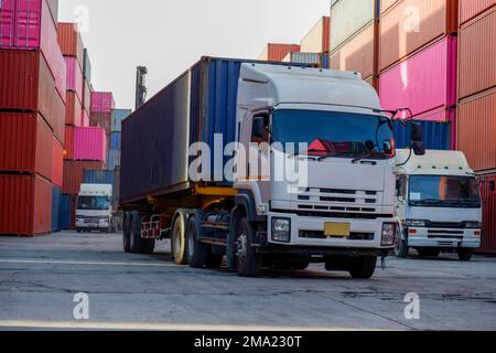 Trucks in the container depot Focus on imports and exports Stock Photo ...