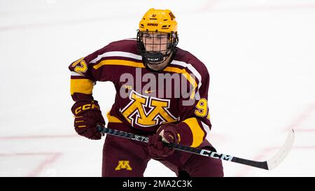 Minnesota forward Logan Cooley (92) works around Quinnipiac forward ...