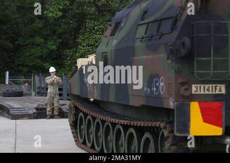 An M992 Field Artillery Ammunition Support Vehicle drives onto a ...