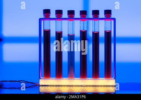 samples of radioactive liquid in test tubes in a nuclear physics ...