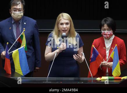 Ukrainian lawmaker Kira Rudik , center right, streams live to Ukraine ...